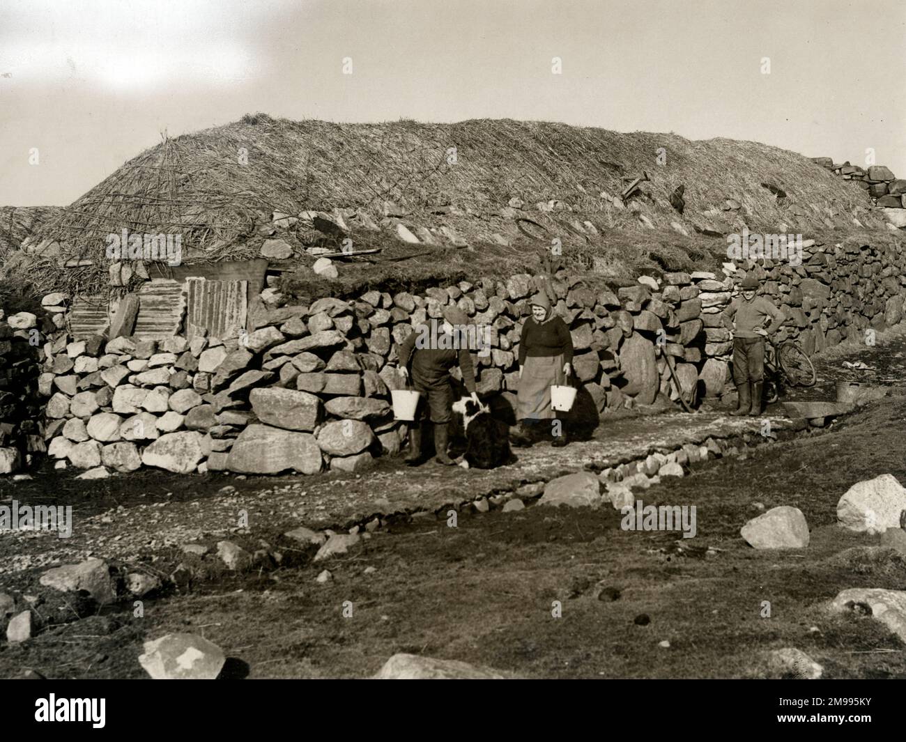 Crofter's home built of stone with a thatched roof on the Isle of Lewis ...