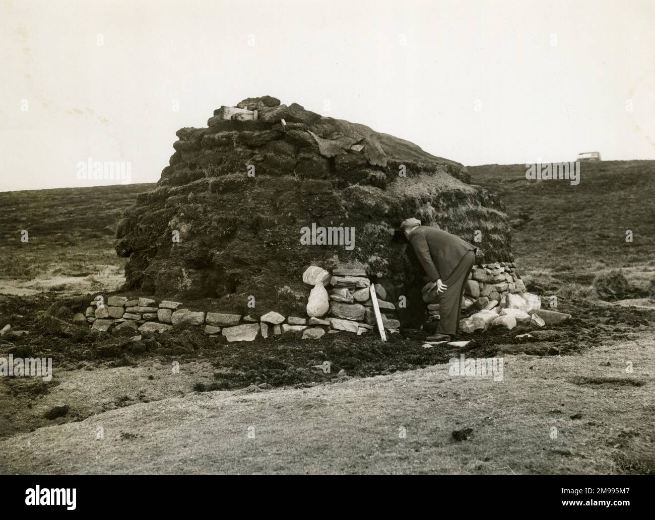 Small stone wall and turf hut, Isle of Lewis, Scotland, used by crofter ...