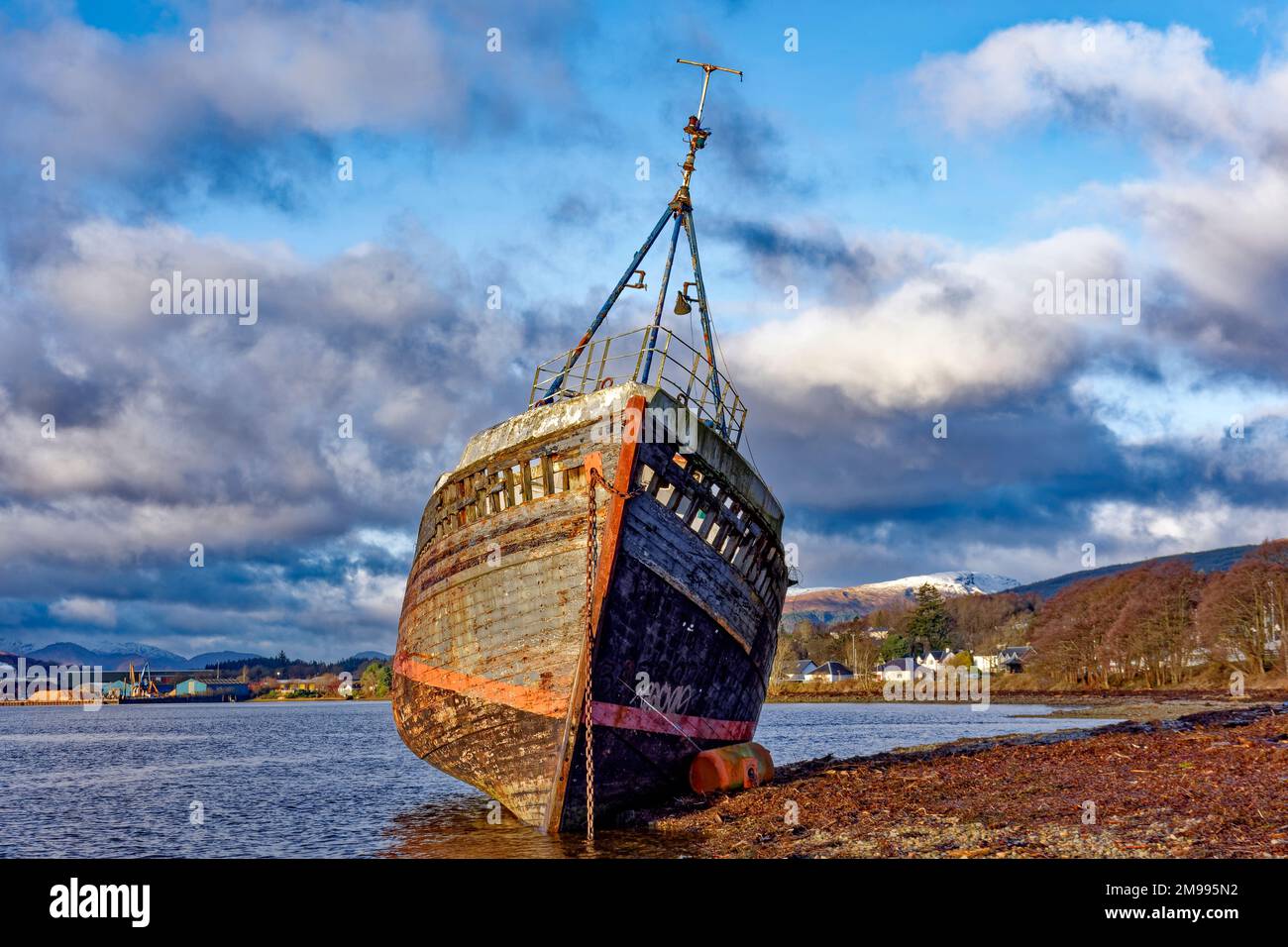 Old Boat of Caol Fort William Scotland a blue sky and the boat lying on ...