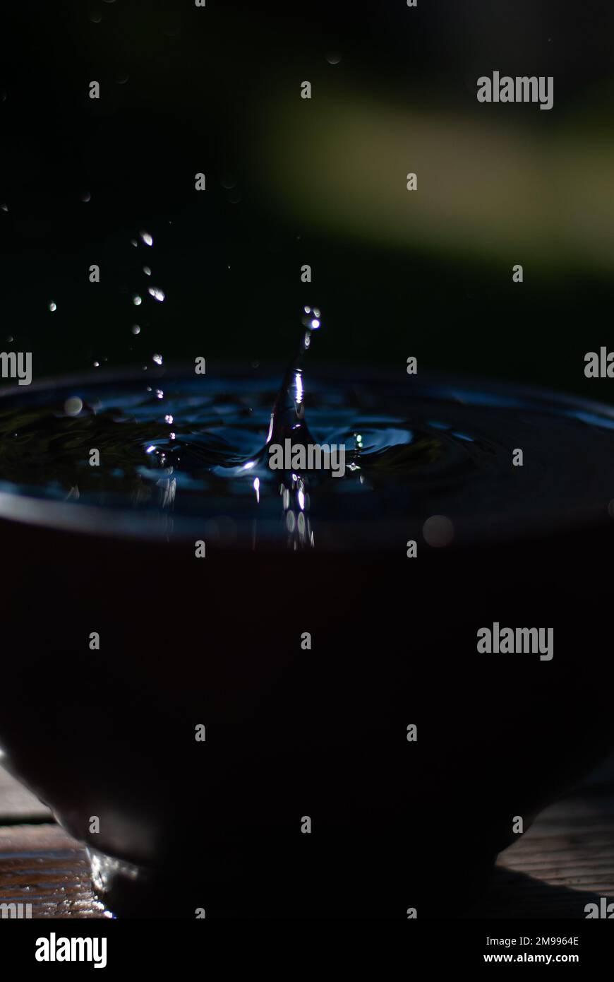 View on drops of water over the plate of water Stock Photo - Alamy