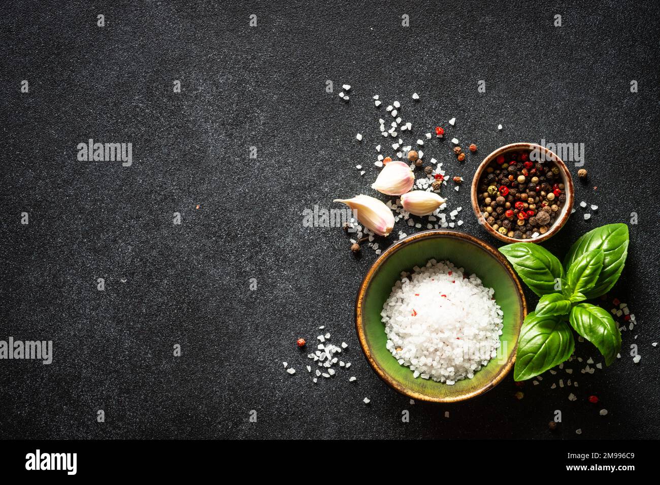 Food cooking background with spices and herbs at black table. Top view ...
