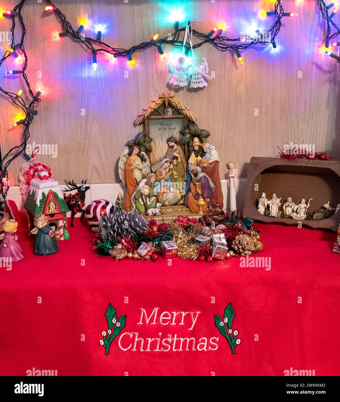 Christmas display featuring Manger scenes is displayed in a home at ...