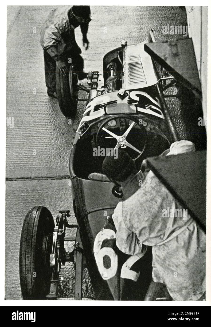 Racing car on a wet track -- the tyres had to be specially treated with ...