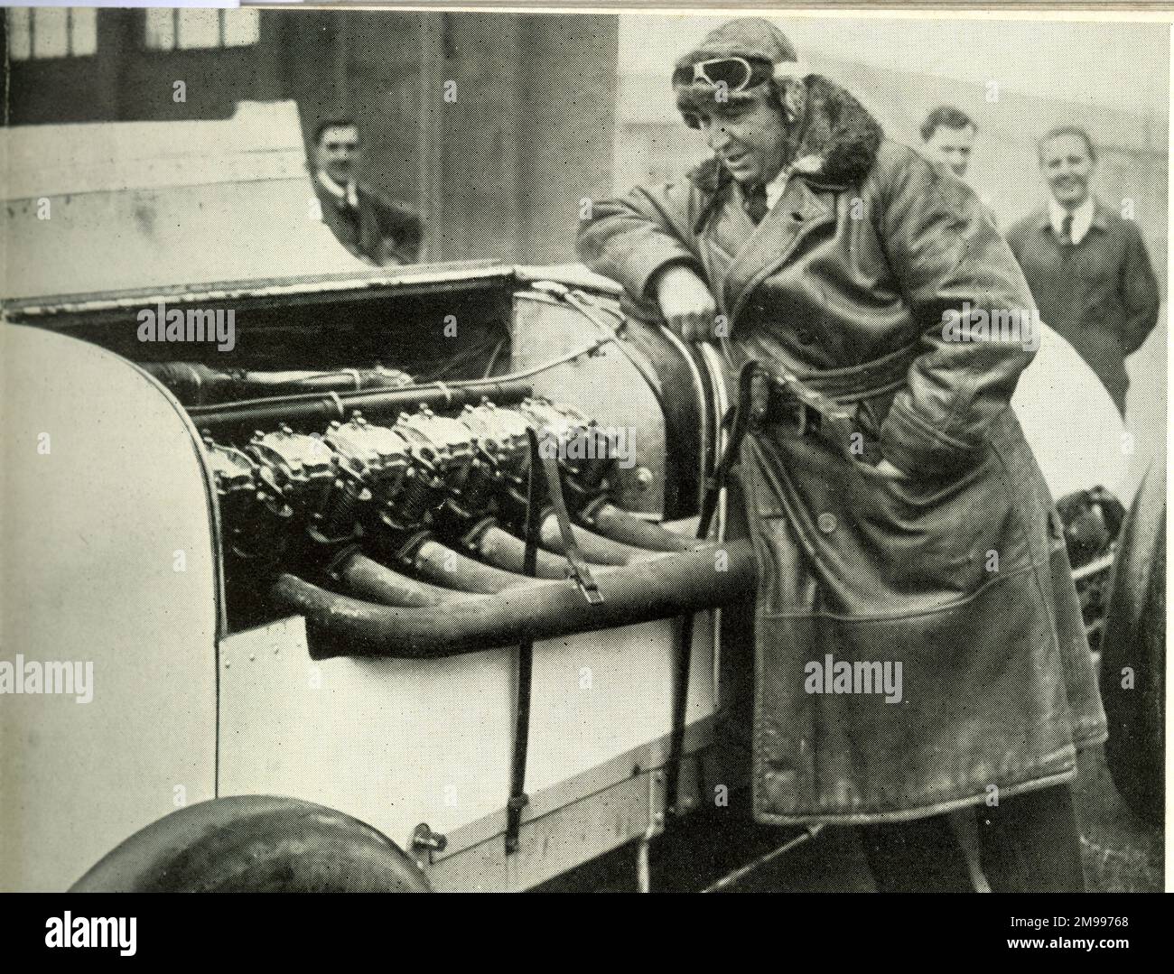 Parry Thomas, motor racing driver, inspecting the 400 hp engine on Babs ...