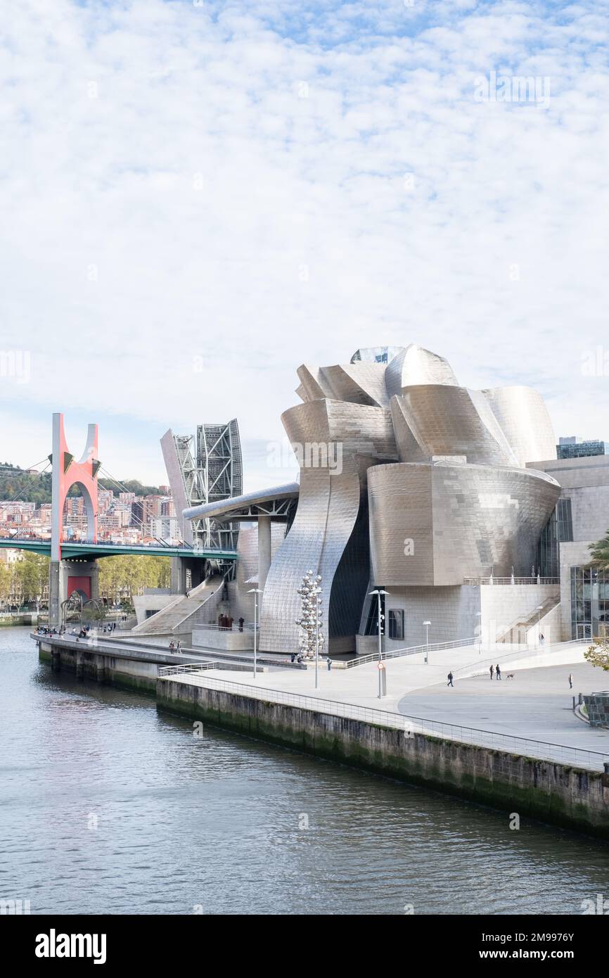 The Guggenheim Bilbao, by Frank Gehry, on the Nervión River, with Arcos ...