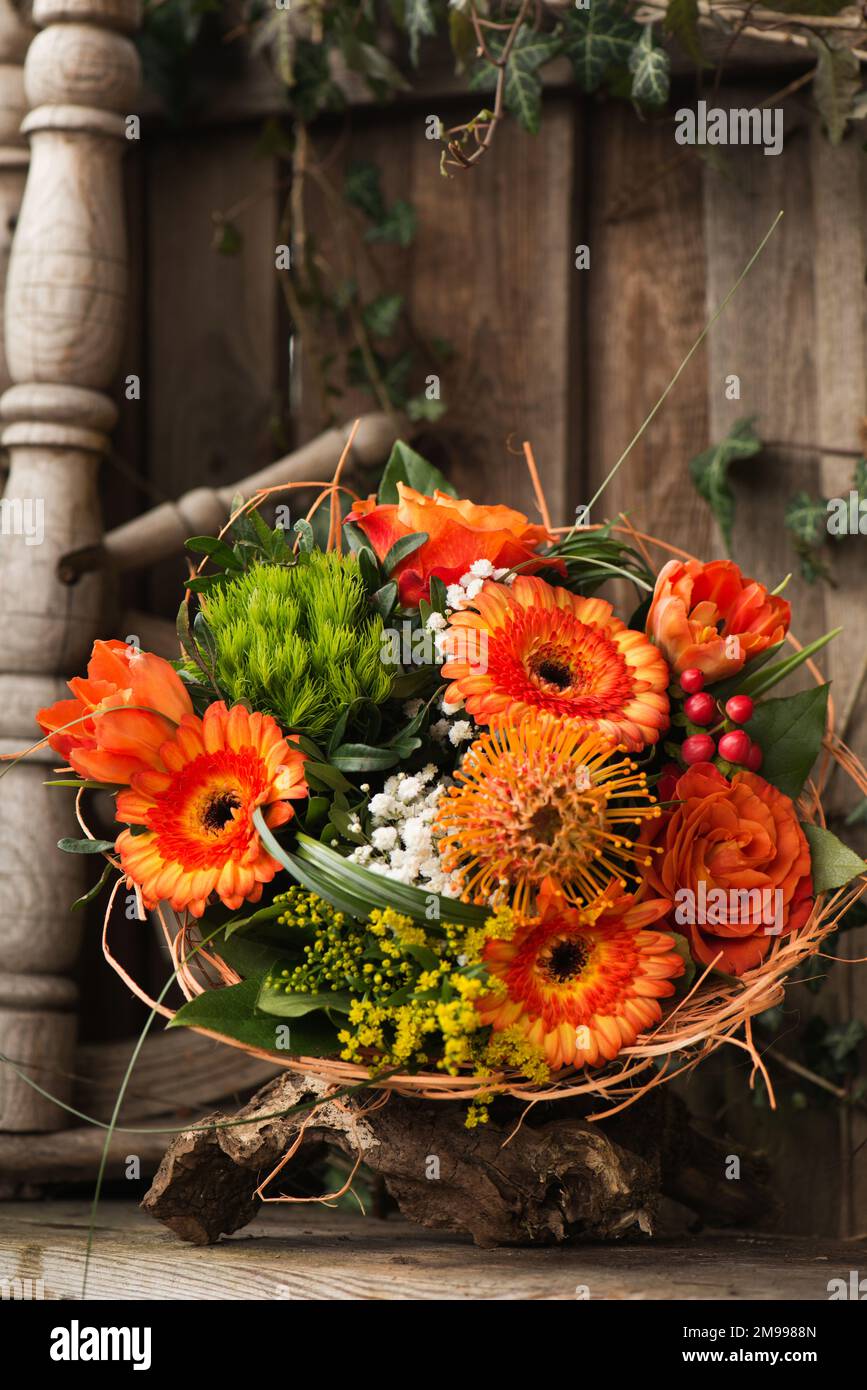 Colorful flower boquet with old wooden spinning wheel Stock Photo - Alamy