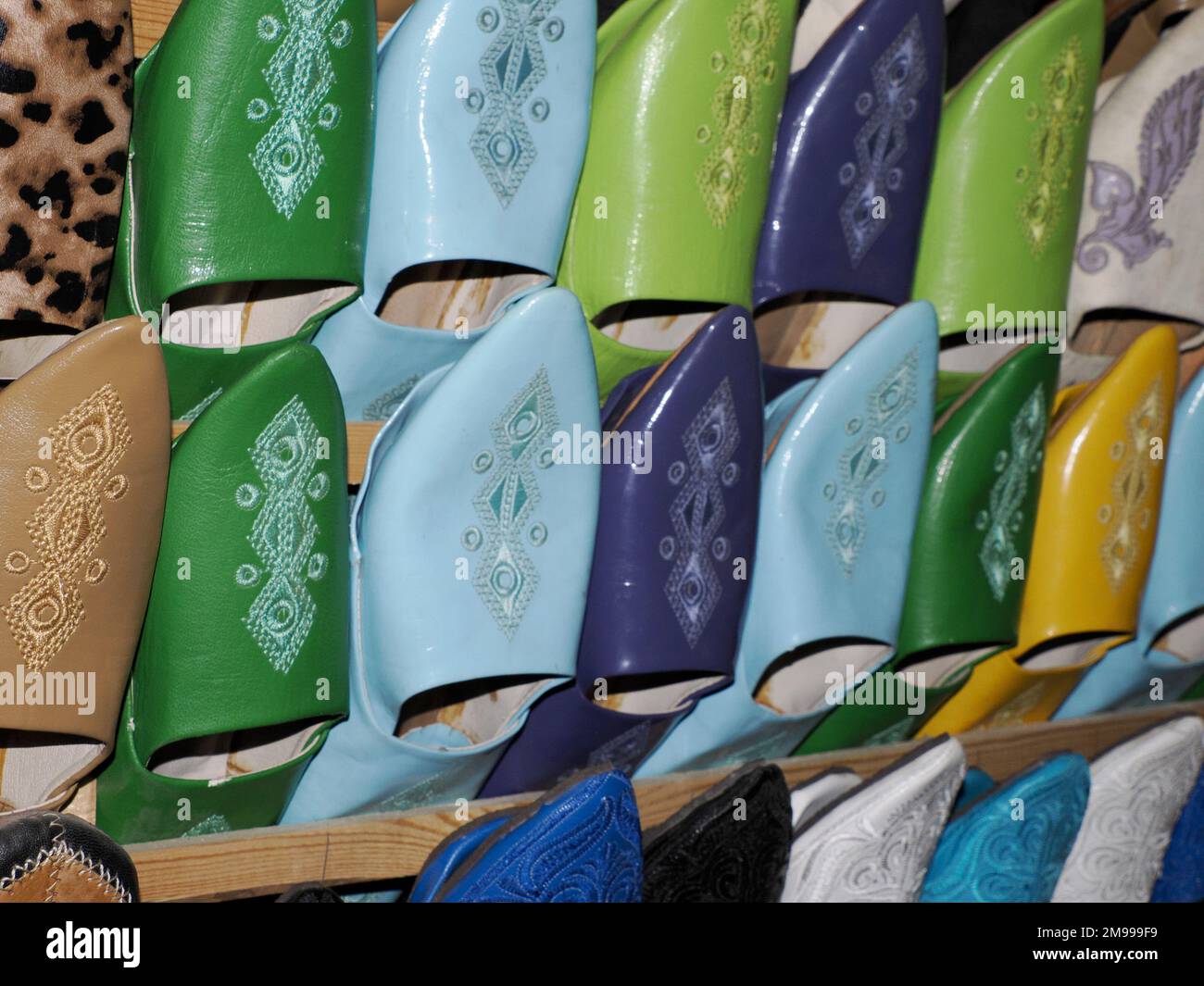 Colorful handmade leather slippers waiting for clients at shop in Fes ...