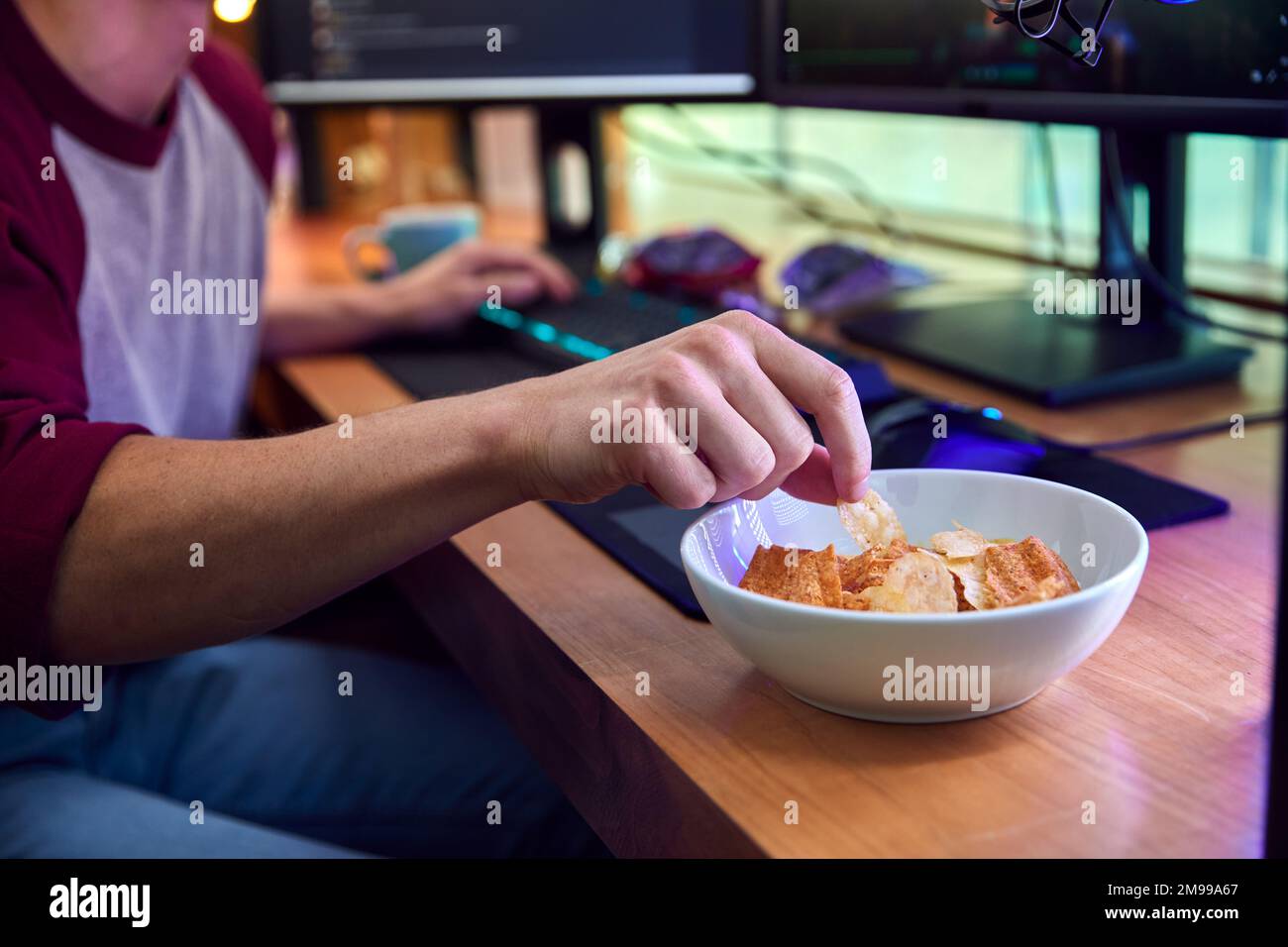 Unhealthy eating at desk hi-res stock photography and images - Alamy