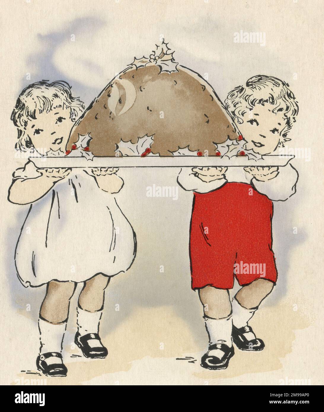 A little boy and girl carry a very large Christmas pudding Stock Photo ...