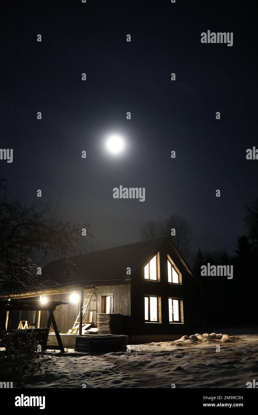 Landscape with house at night under dark sky with full moon. Spooky ...