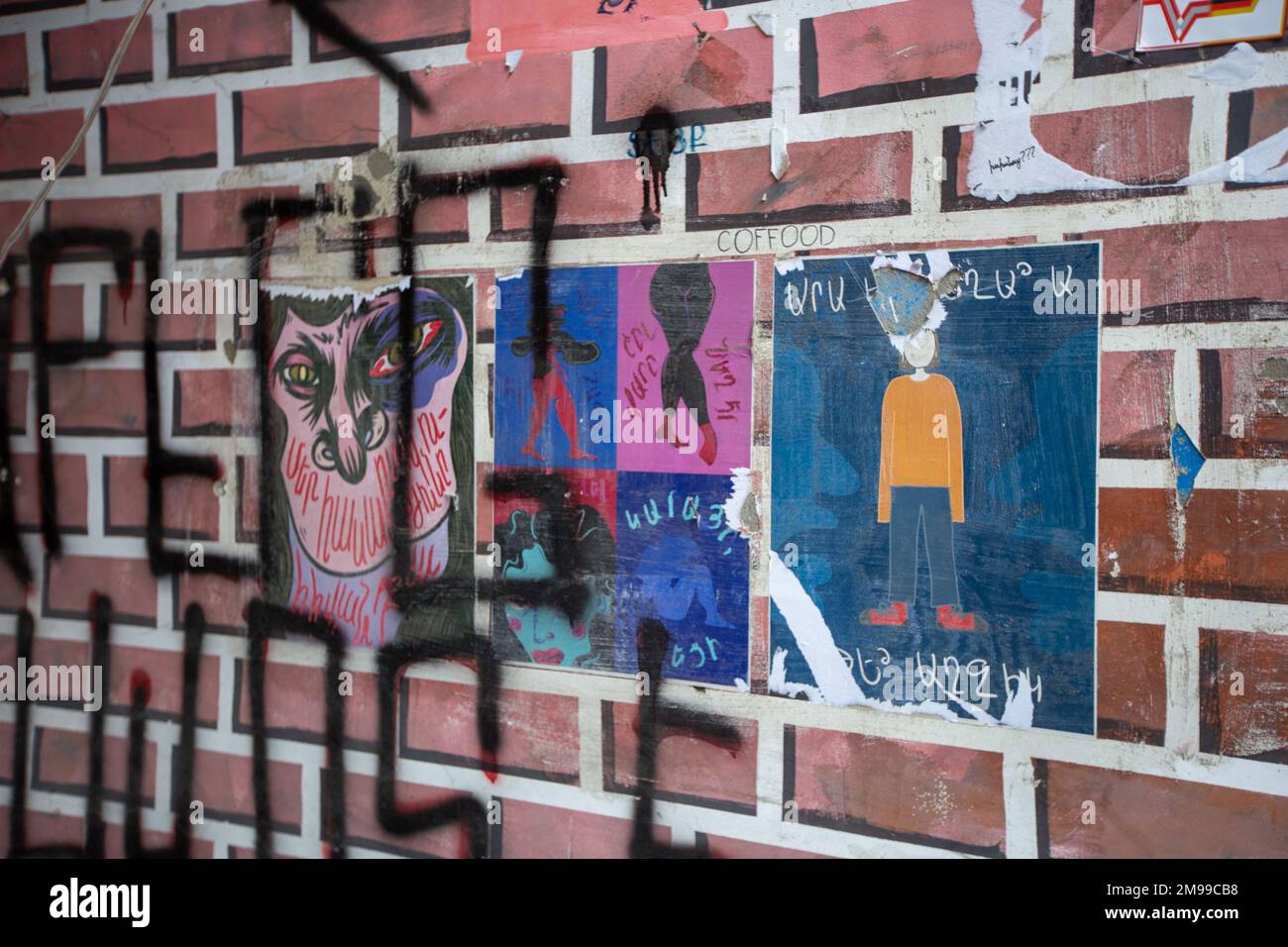 Posters on wall exterior hi-res stock photography and images - Alamy