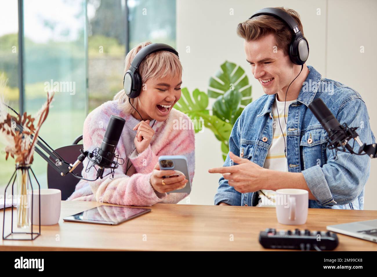 Couple Vlogging Recording Video At Home With Camera Looking At Messages ...