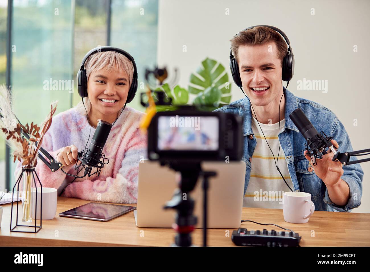 Couple Vlogging Recording Video At Home With Camera Stock Photo - Alamy