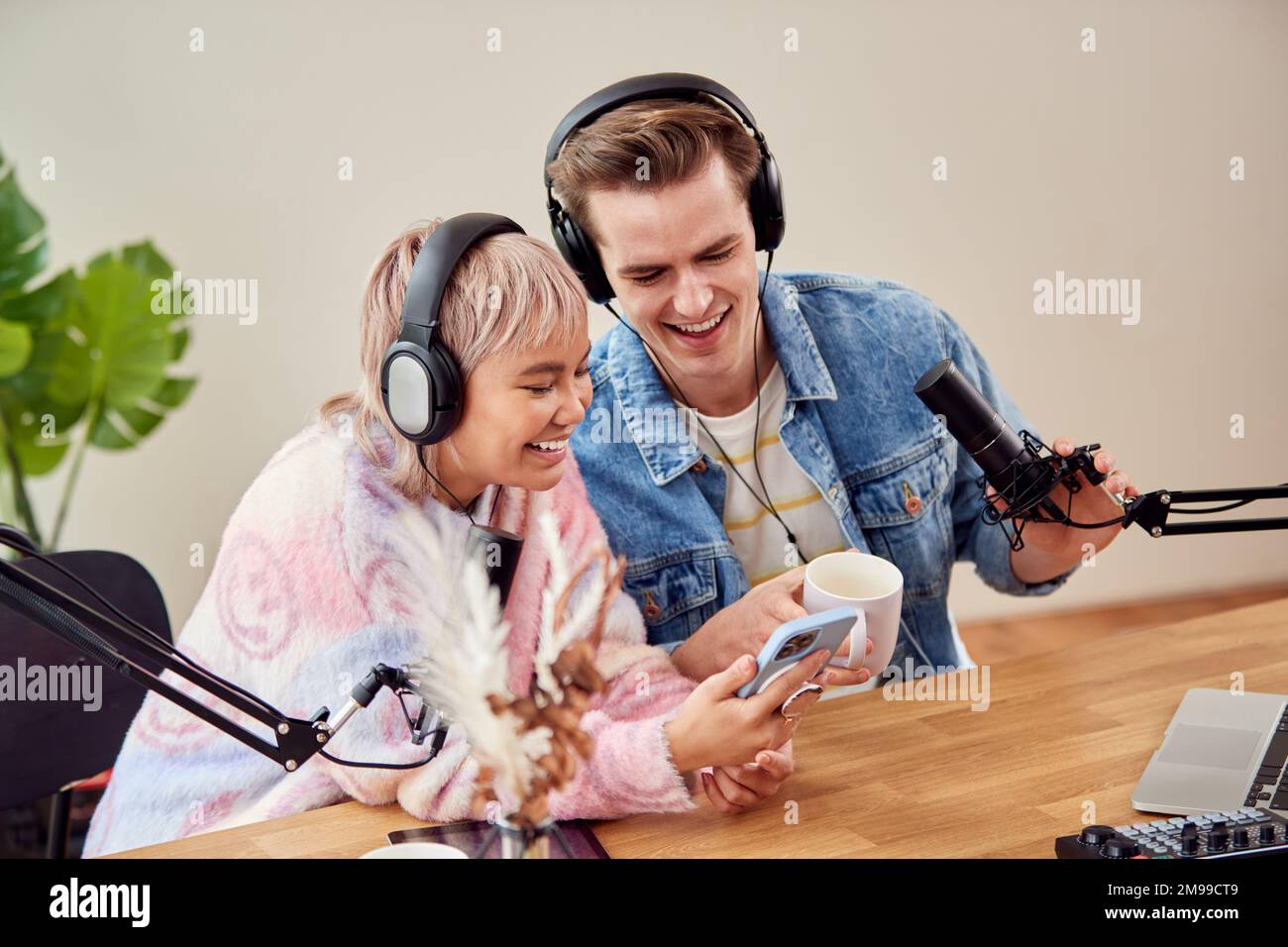 Couple Vlogging Recording Video At Home With Camera Looking At Messages ...