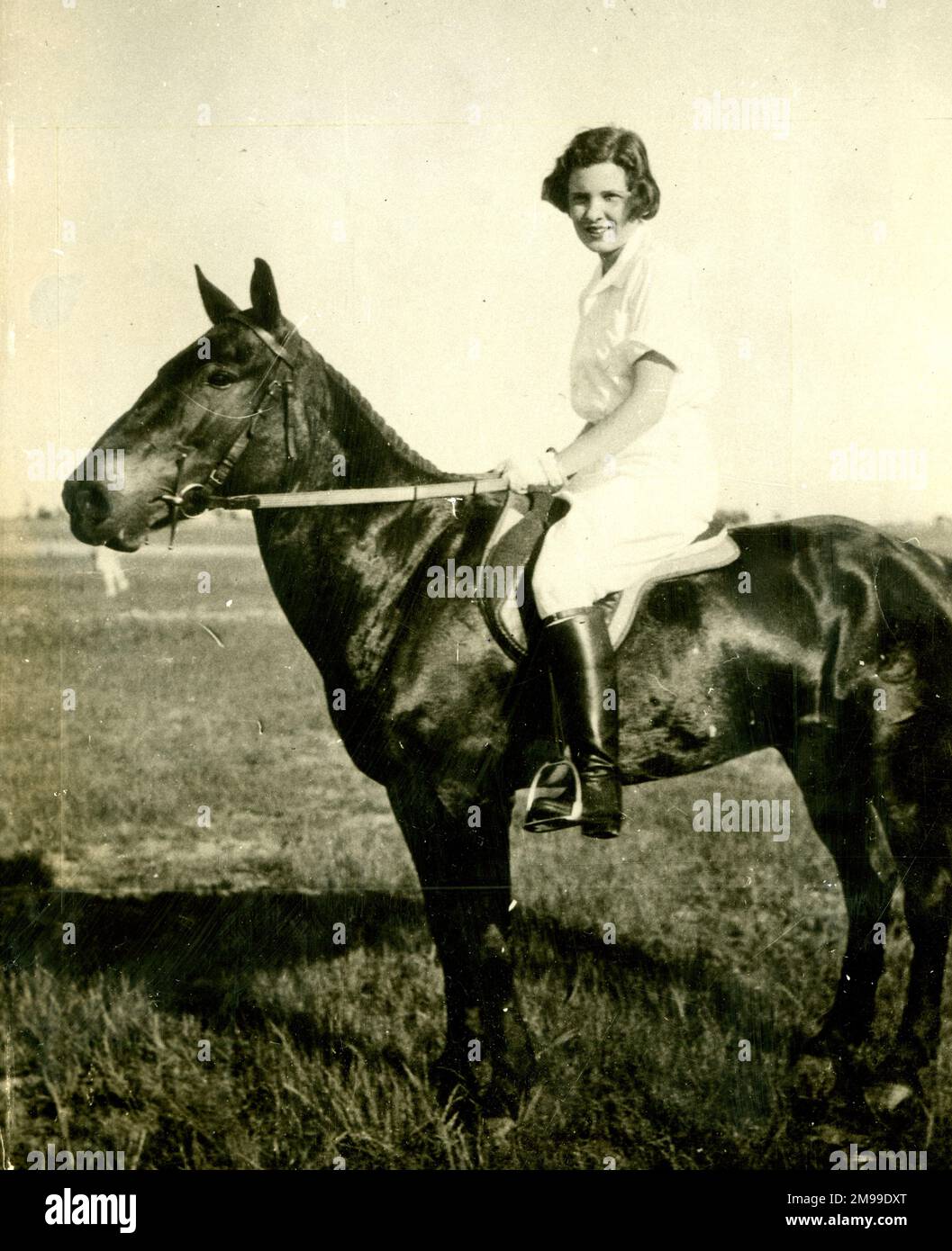 Mrs Pawley, who was later kidnapped by Chinese bandits, seen here on horseback at the racecourse ...