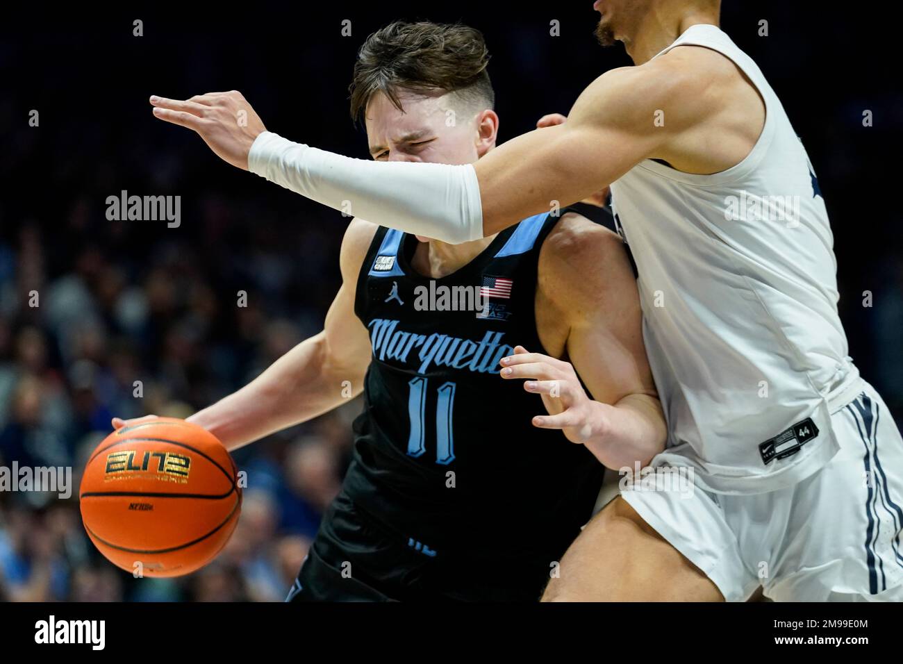 Xavier Musketeers guard Colby Jones, right, makes contact with the face ...