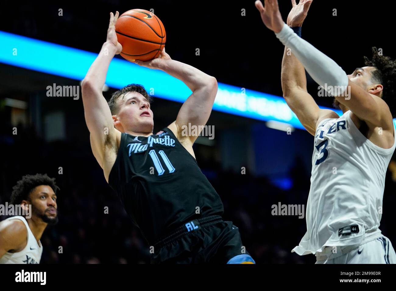 Marquette guard Tyler Kolek (11) shoots against Xavier's Colby Jones (3 ...