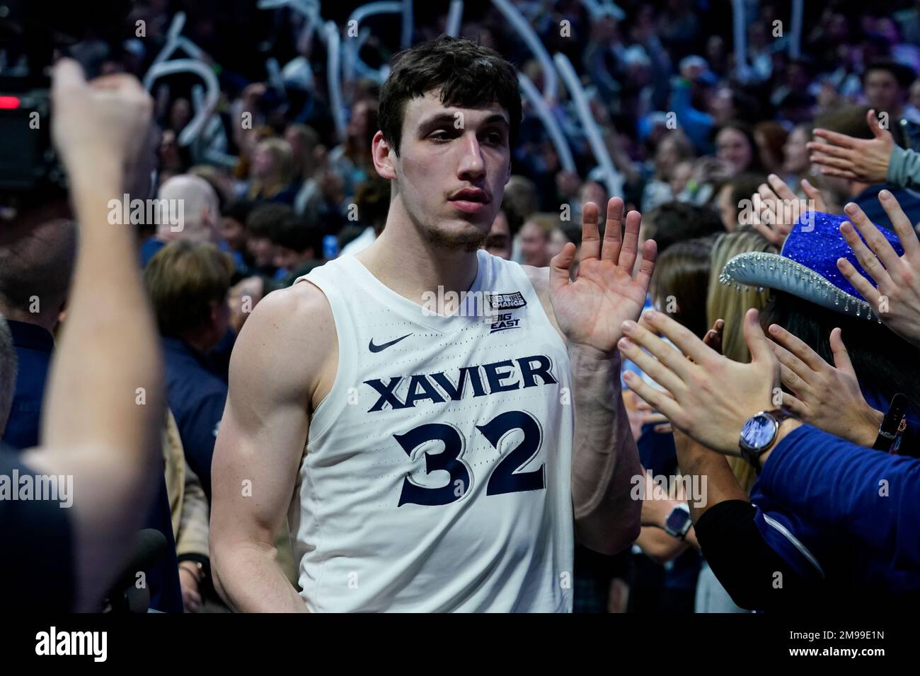Xavier's Zach Freemantle (32) celebrates with fans after defeating ...