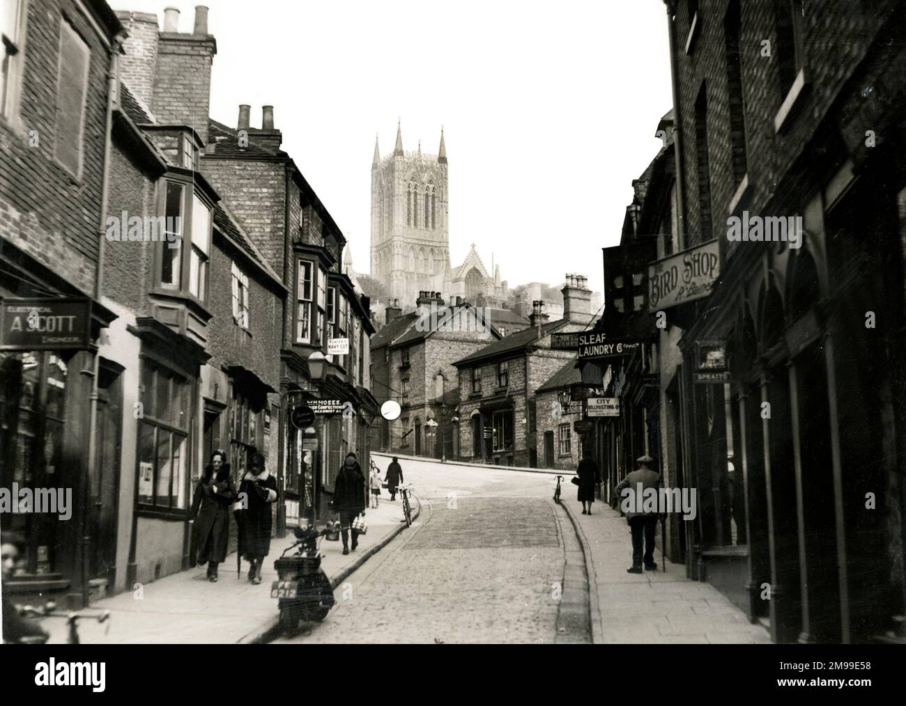 Street scene in Lincoln, with the Cathedral in the middle distance ...