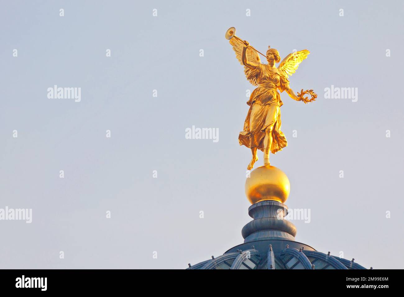 Golden angel statue on a building in Dresden, Germany Stock Photo - Alamy