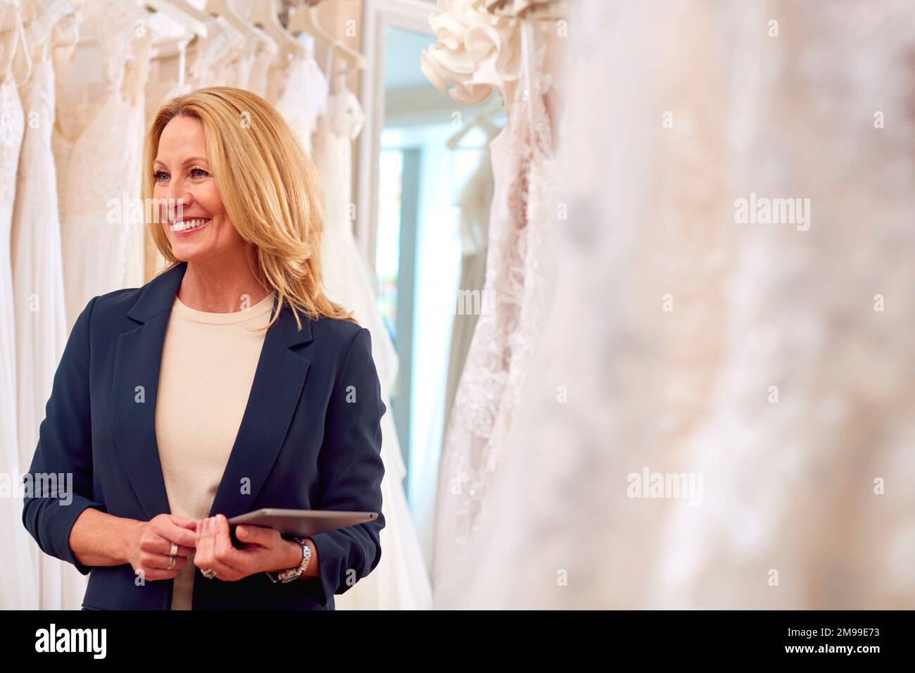Wedding dress shop assistant hi-res stock photography and images - Alamy