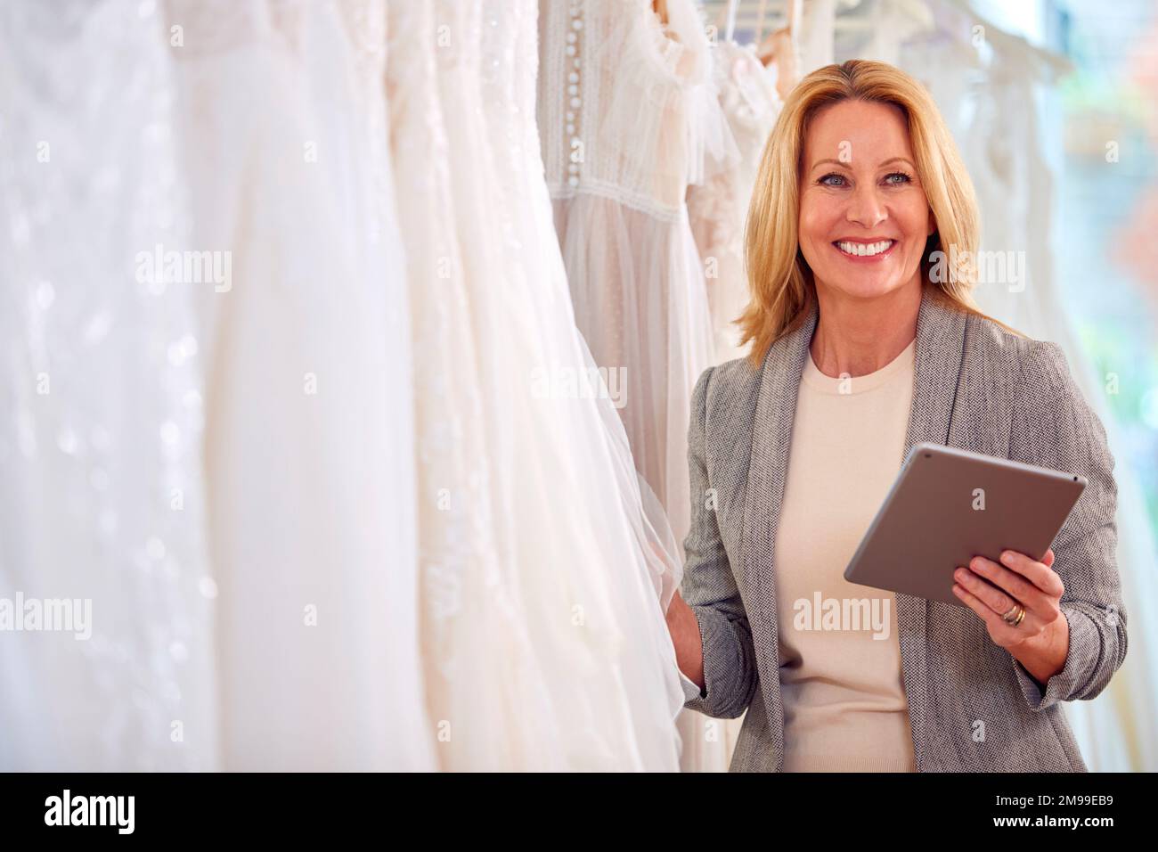 Wedding dress shop assistant hi-res stock photography and images - Alamy