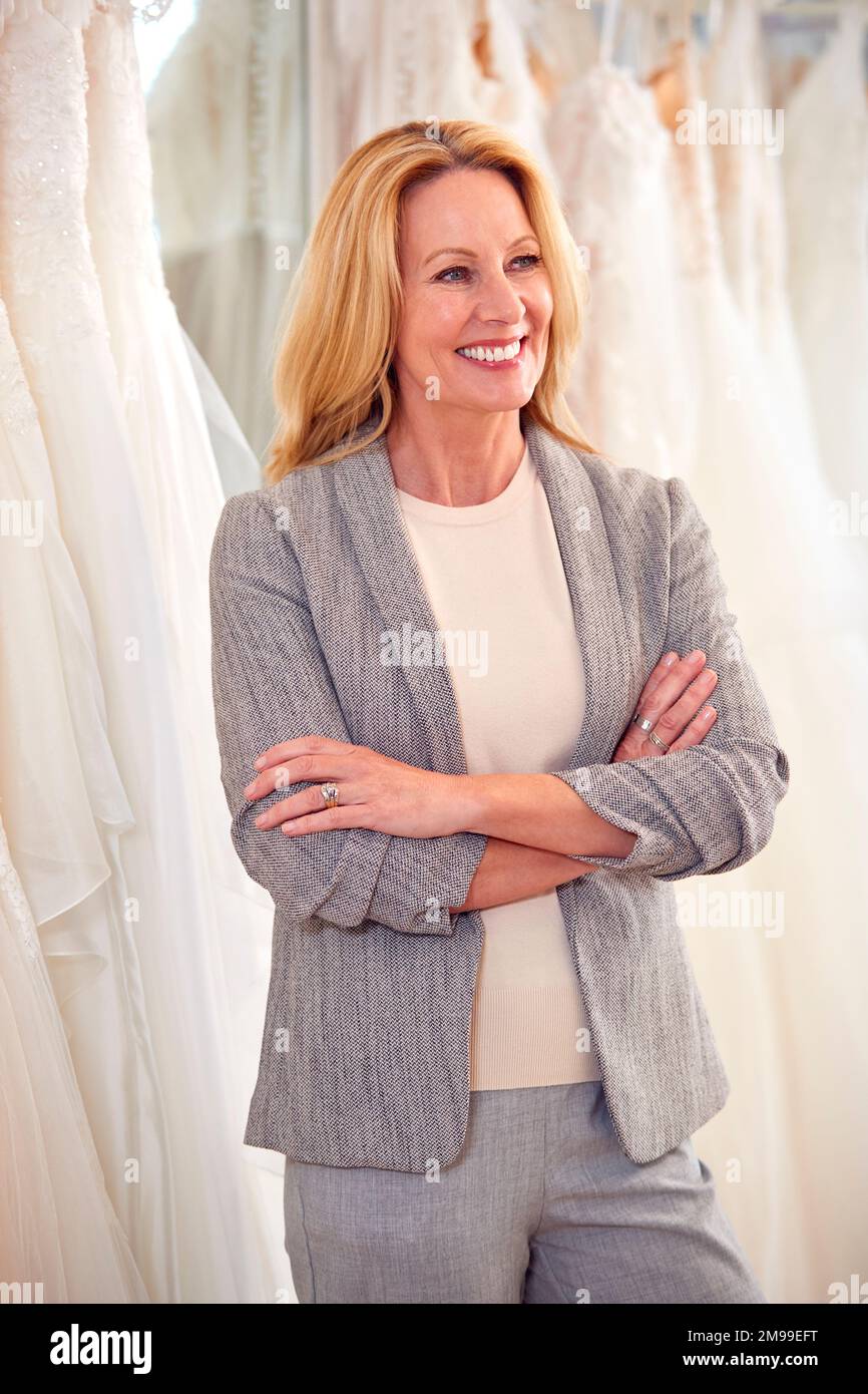 Portrait Of Female Owner Of Bridal Wedding Dress Shop Stock Photo - Alamy