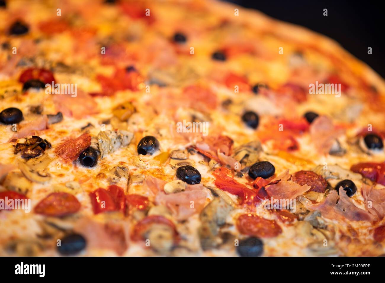 Detail of a pizza on display in a window, selective focus Stock Photo ...