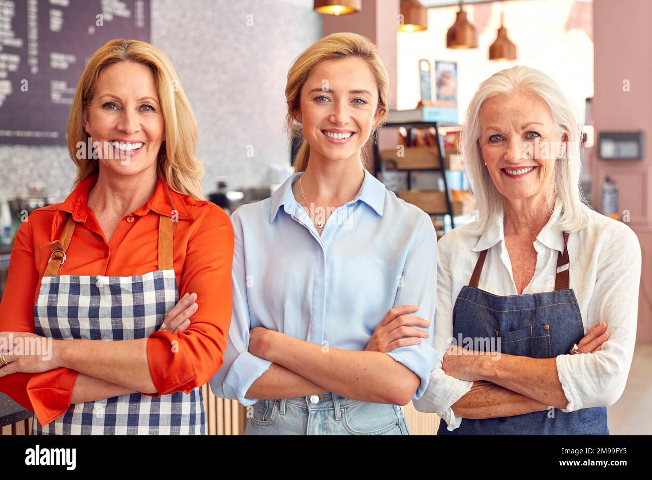 Portrait Of Female Owner And Staff Working In Coffee Shop Or Restaurant ...