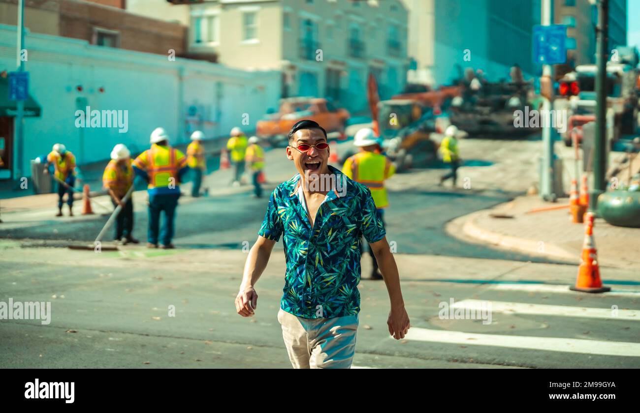 Man walking across crosswalk hi-res stock photography and images - Alamy