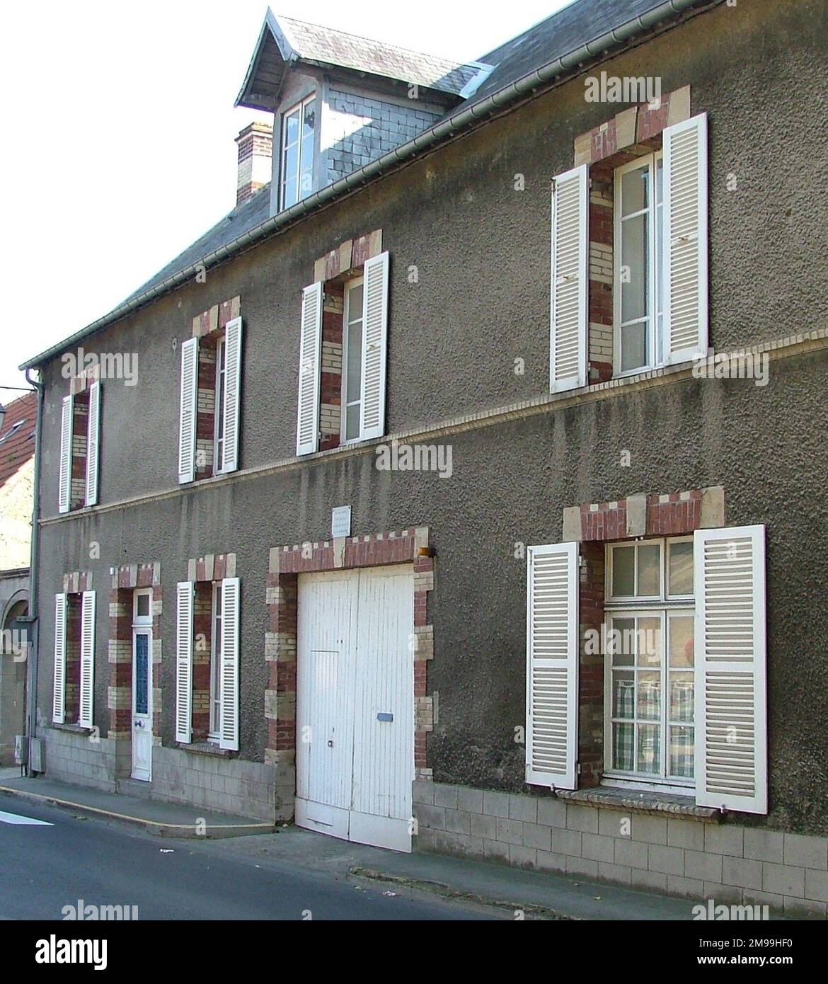 There is a small hard to read Memorial Plaque above the central door ...