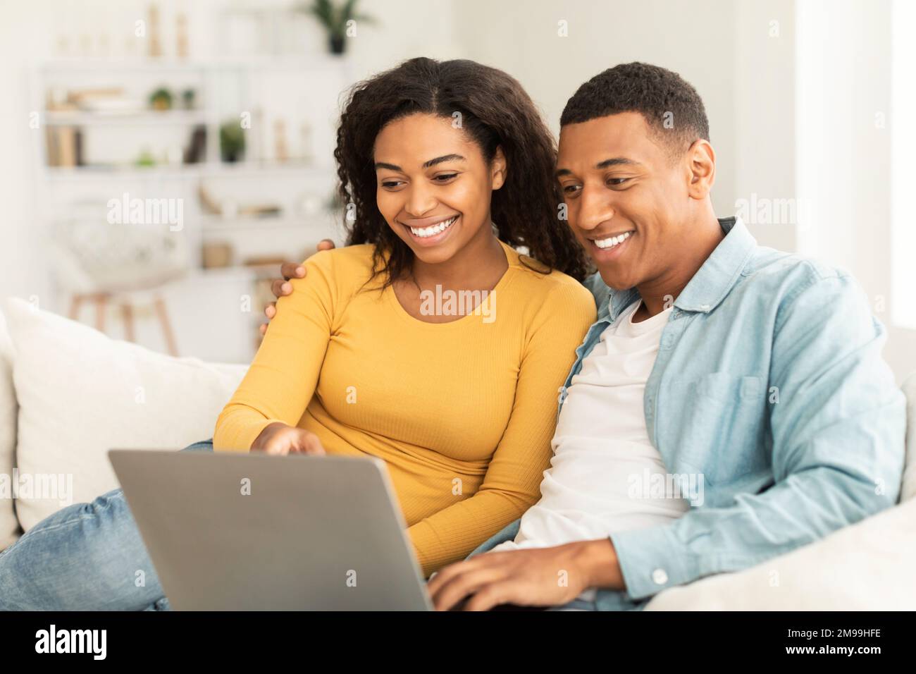 New normal and chat at home. Cheerful young african american couple ...