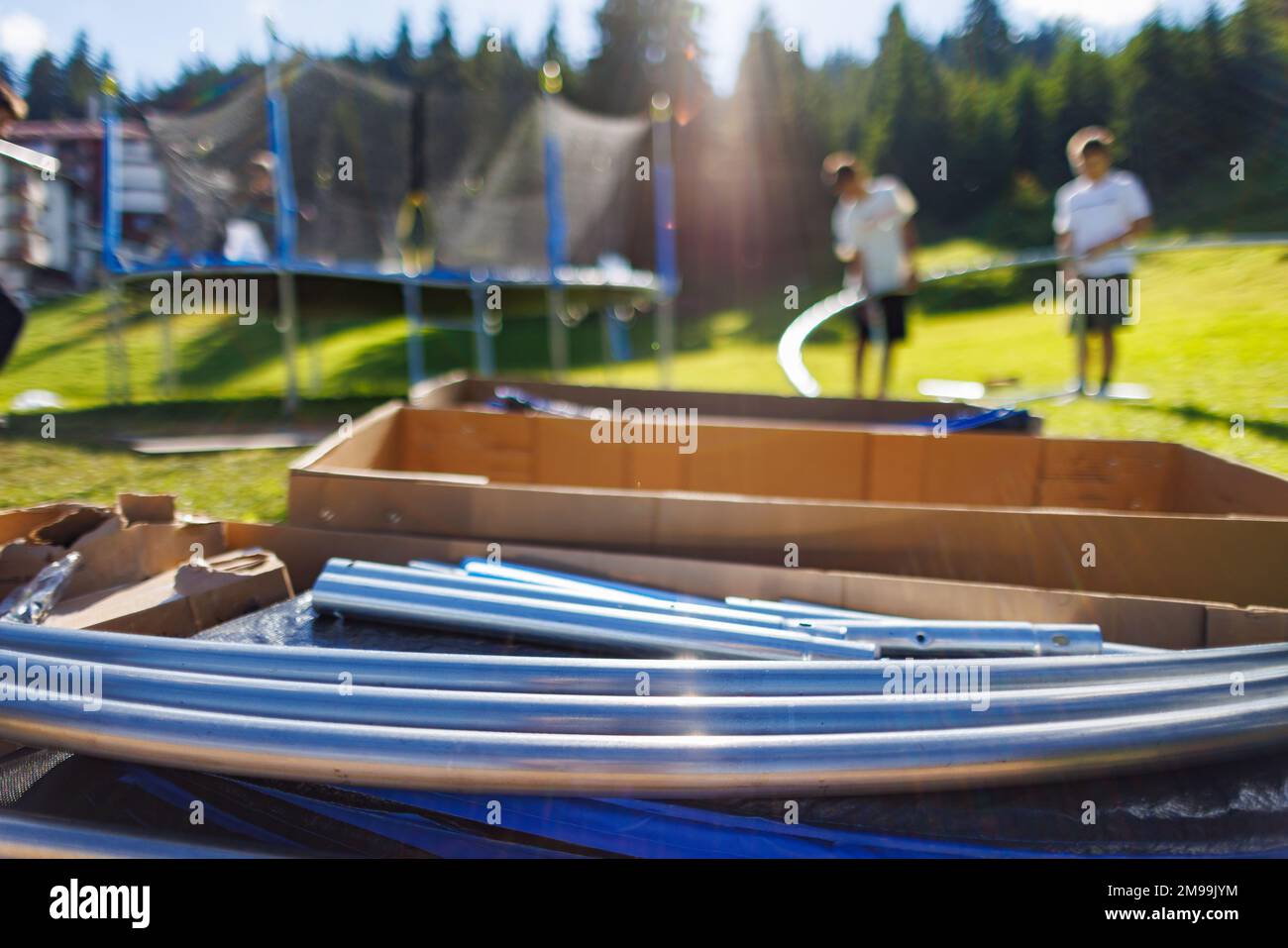 Large cardboard boxes with iron beams and other kit to assemble a ...