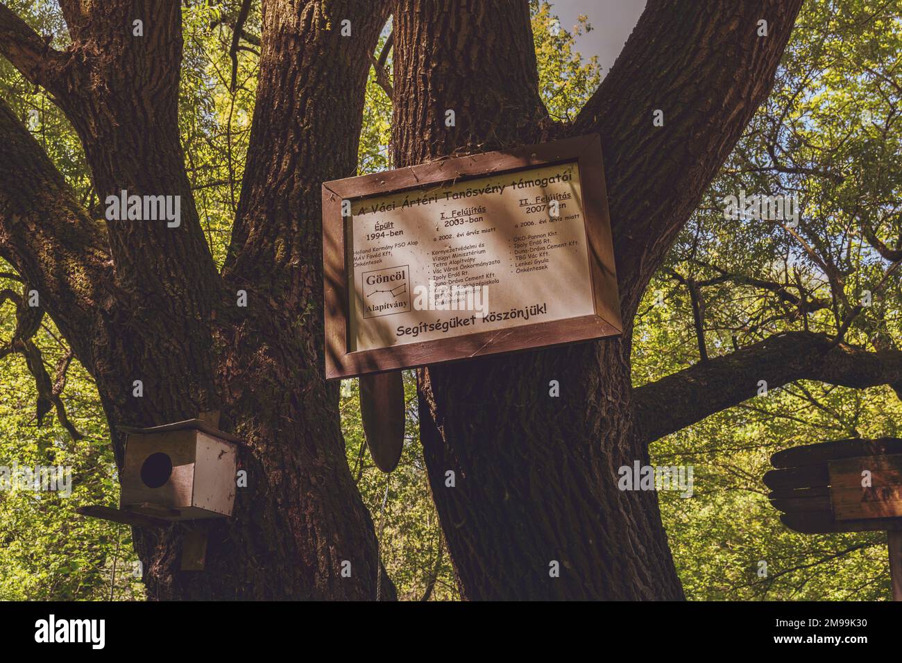 Nature trail information board and man made nest box attached to the ...