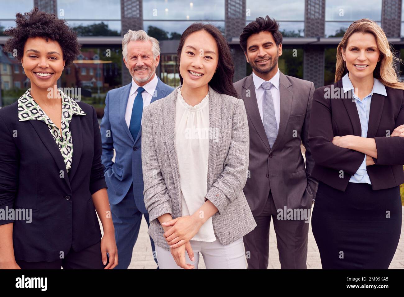 Portrait Of Multi-Cultural Business Team Outside Modern Office Building ...