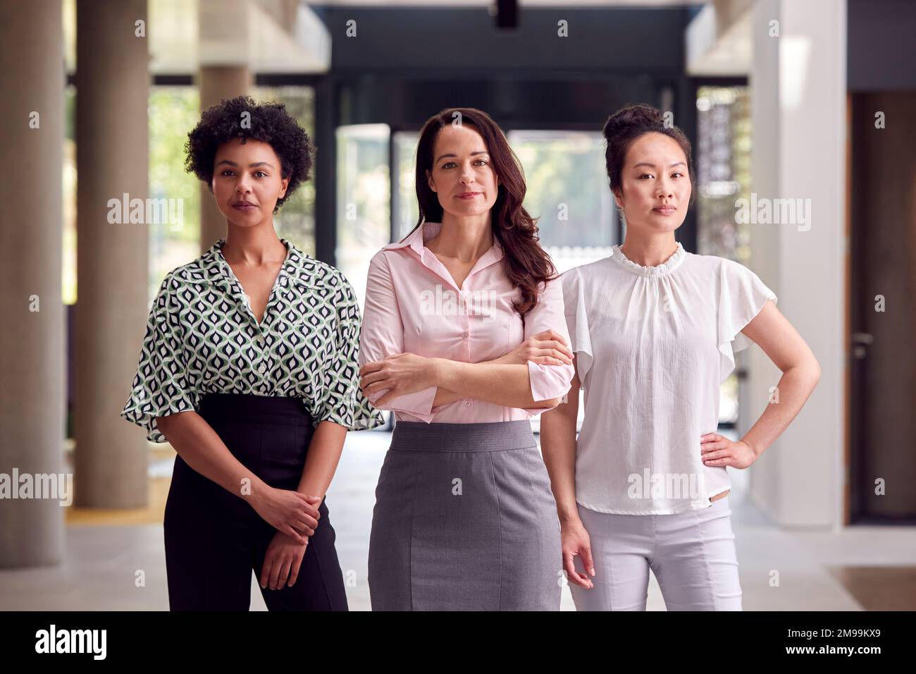 Portrait Of Multi-Cultural Female Business Team Inside Modern Office ...