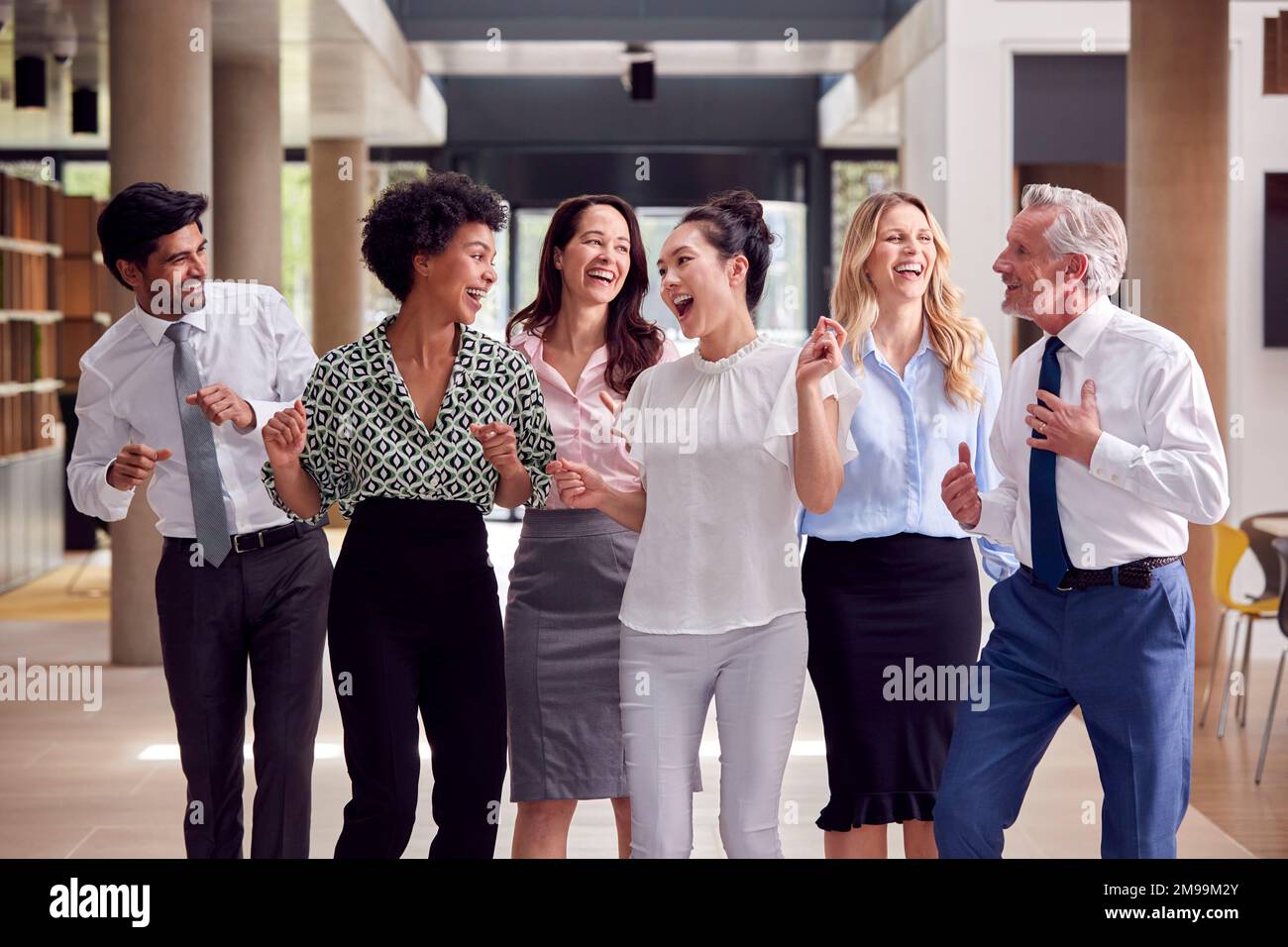 Portrait Of Smiling Multi-Cultural Business Team Having Fun And ...