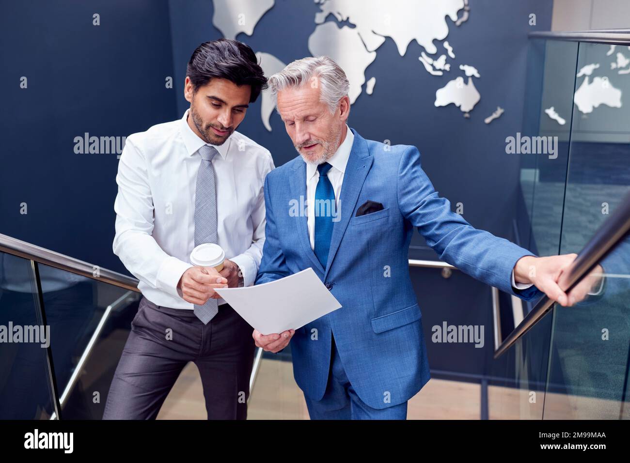 Business people discussing world map hi-res stock photography and ...