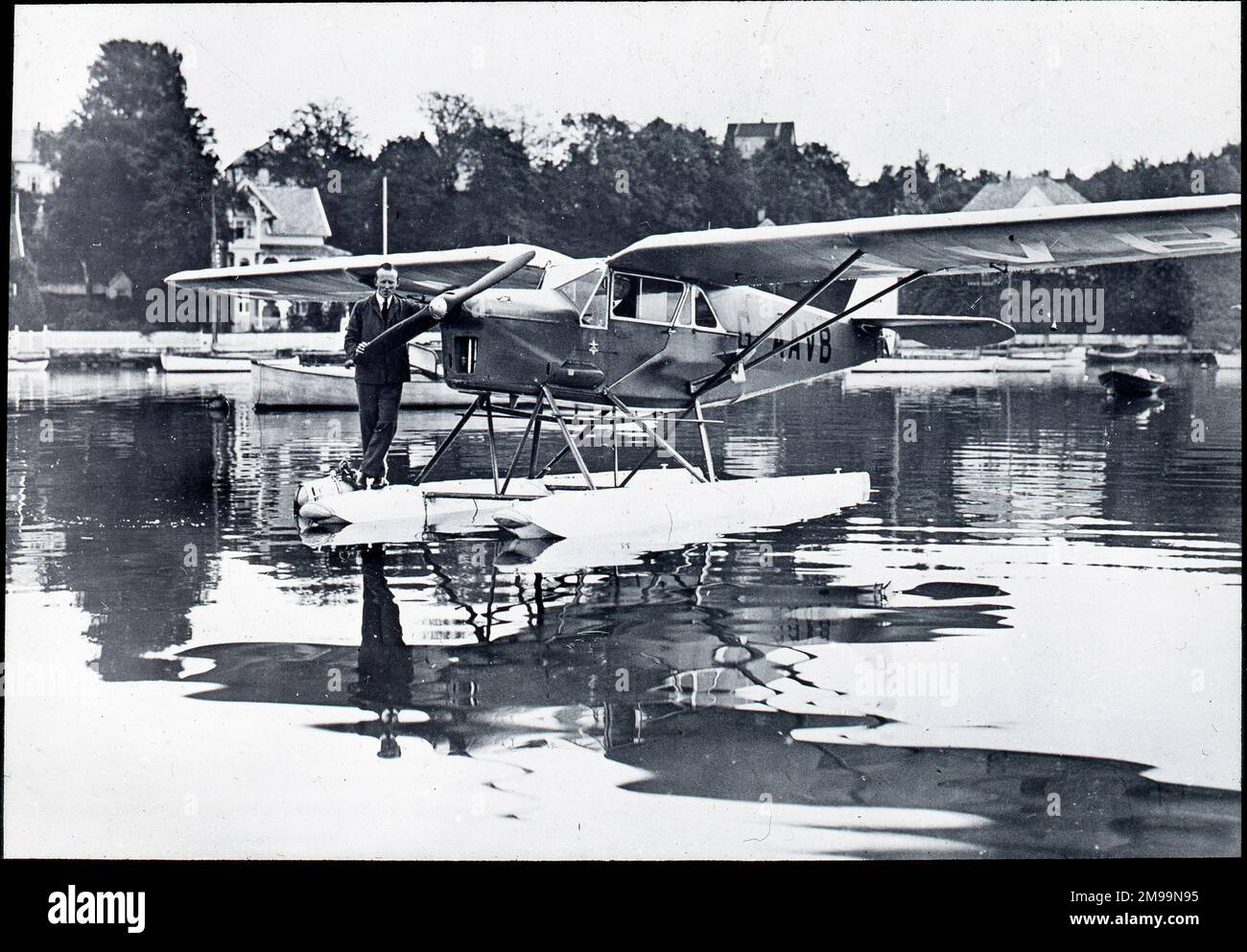 Captain The Master of Sempill standing on DH.80A Puss Moth (G-AAVB ...