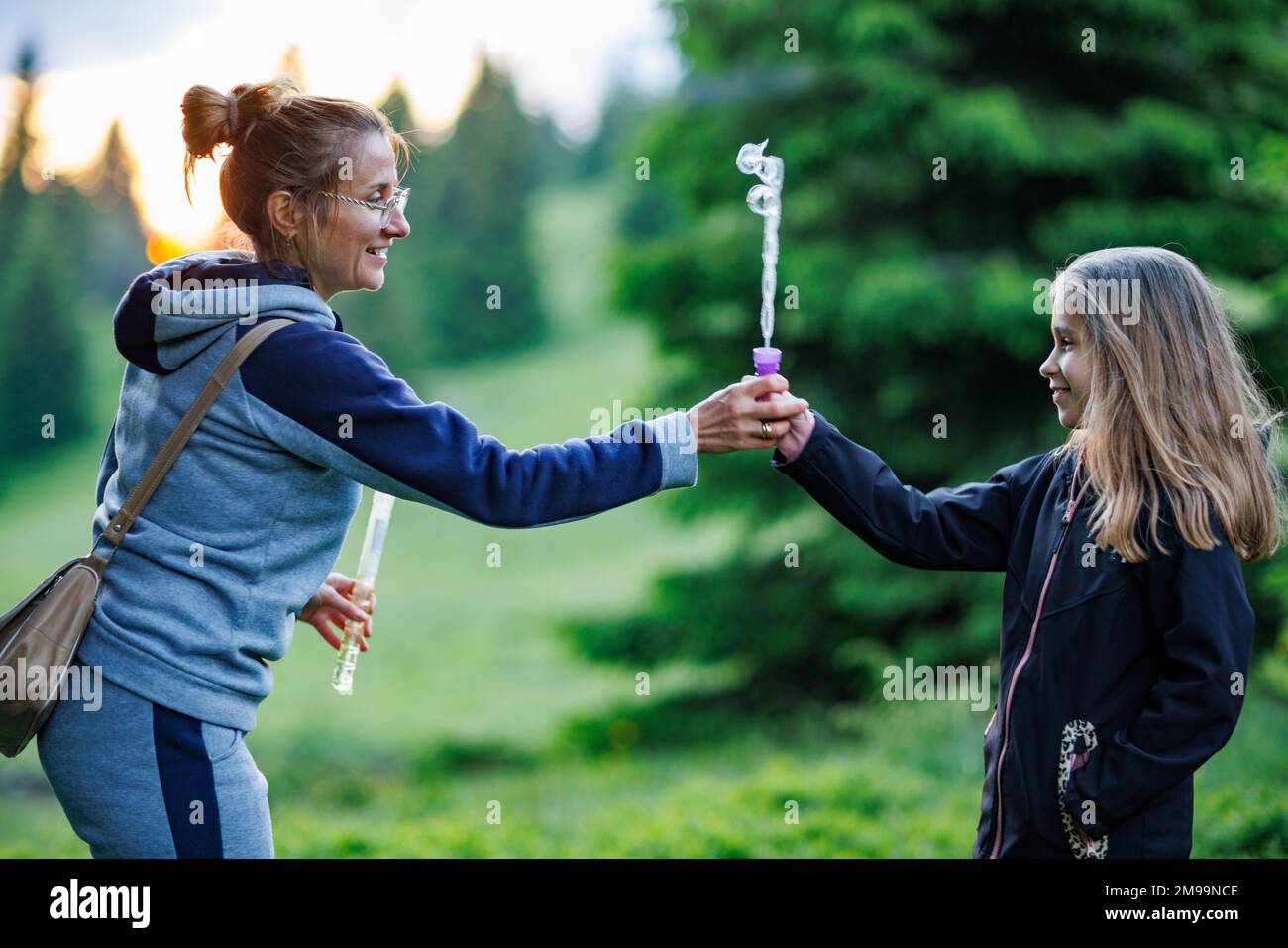 Happy kind caring mother and her cute smiling cheerful daughter with ...