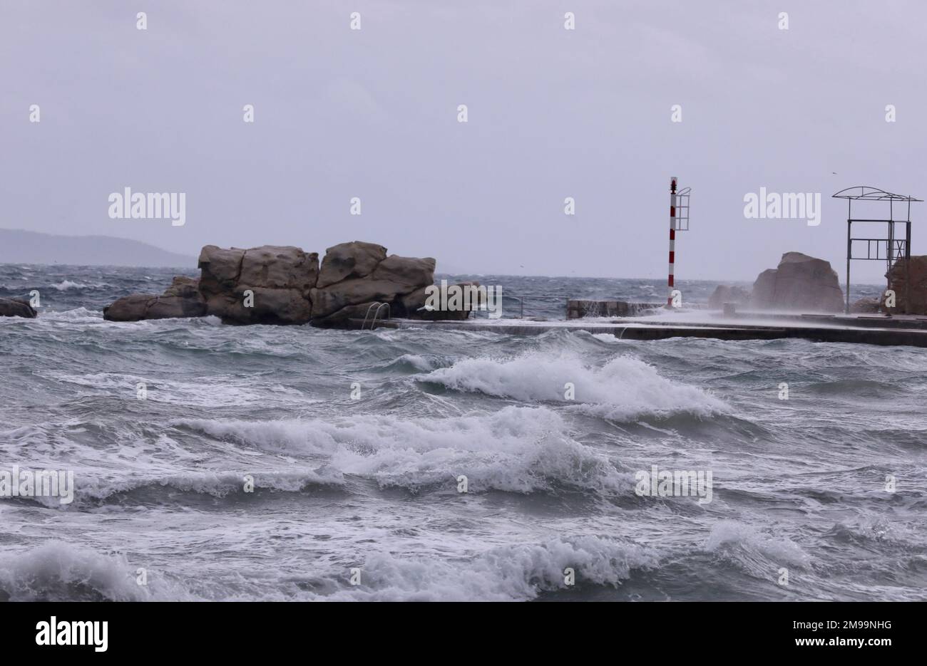 A strong south wind rases big waves and hampers maritime traffic in the ...