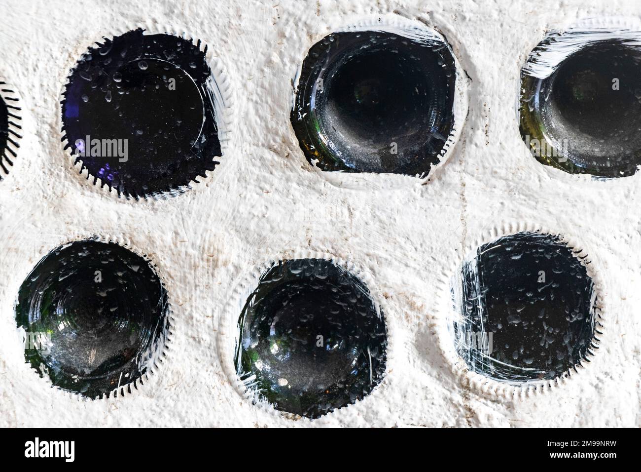 Decorative white walls with bottles set in concrete on Isla Holbox ...