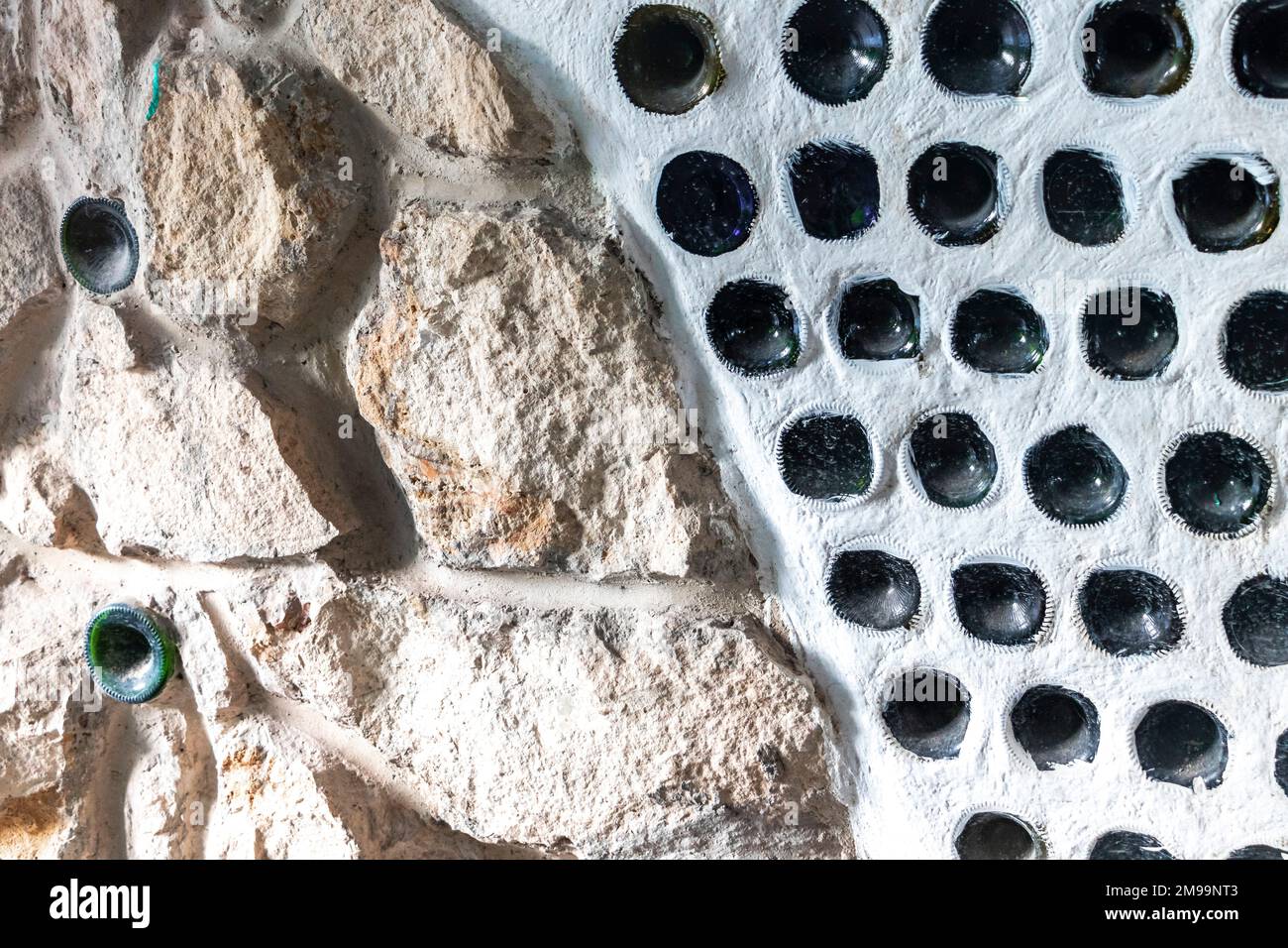 Decorative white walls with bottles set in concrete on Isla Holbox ...