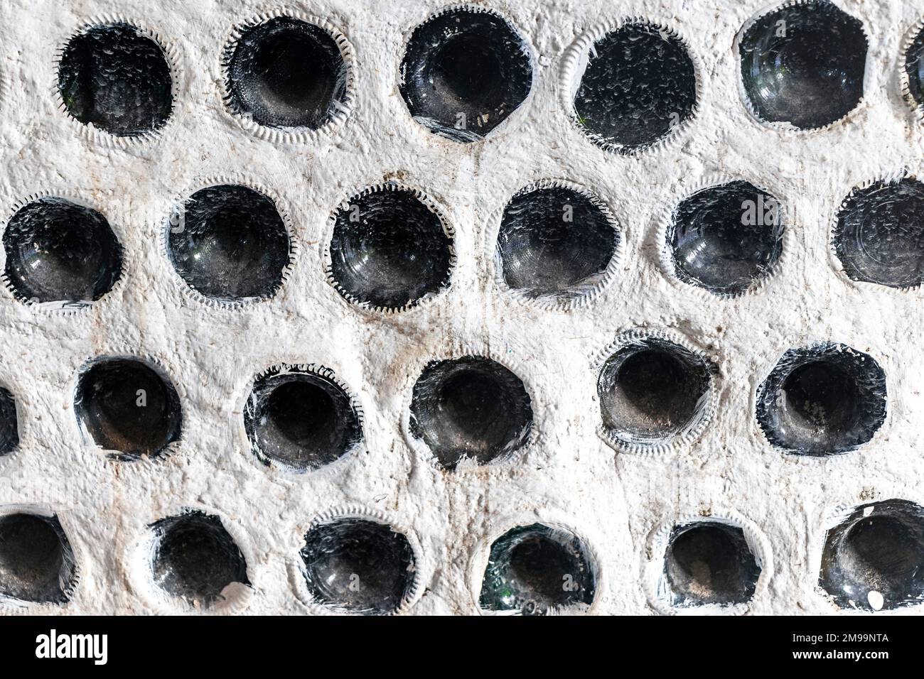 Decorative white walls with bottles set in concrete on Isla Holbox ...