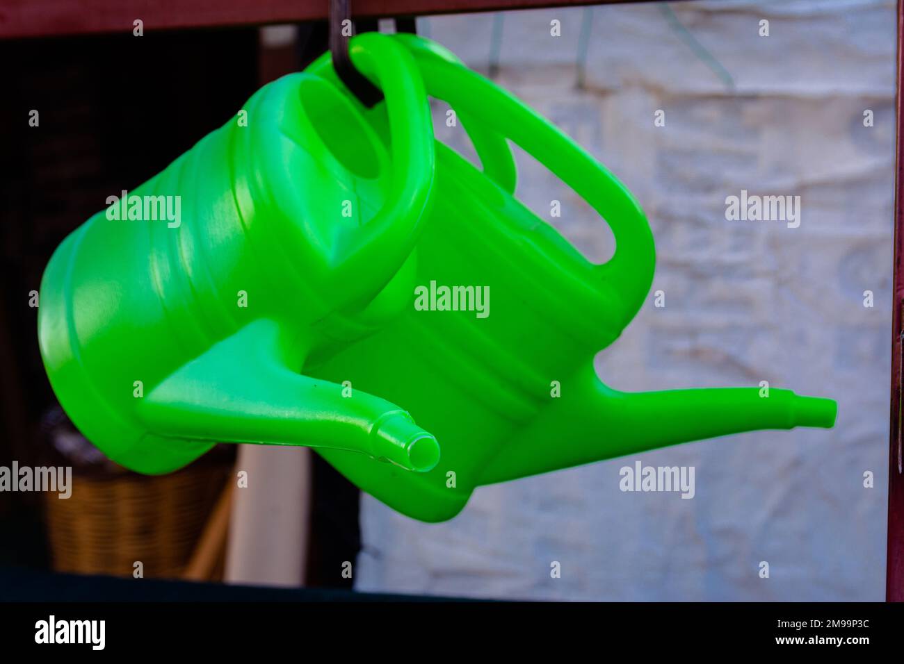 Plastic green watering cans are sold on the street in the Turkish city ...