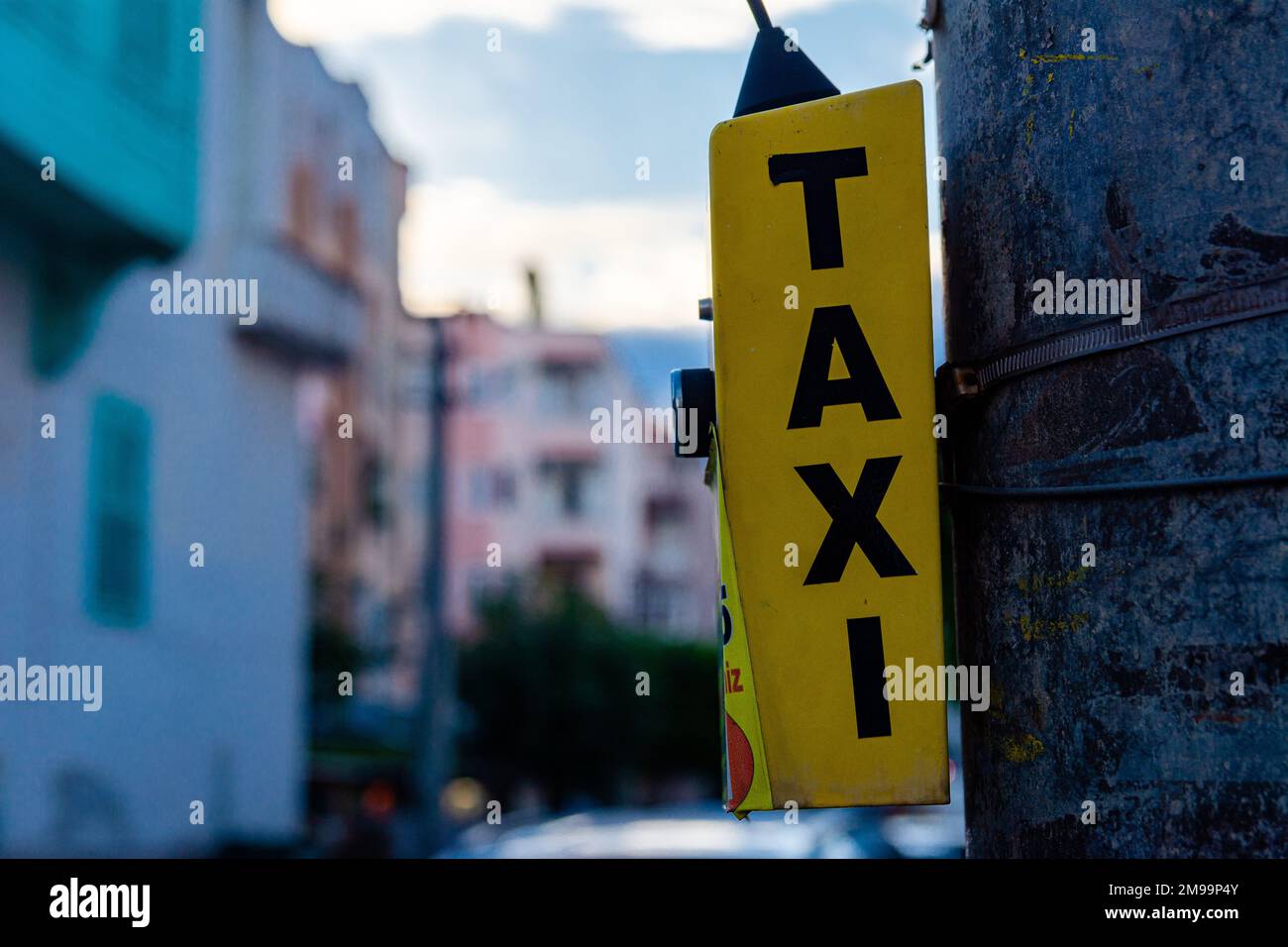 Button to call a taxi in the Turkish city of Alanya. Evening photo of a ...