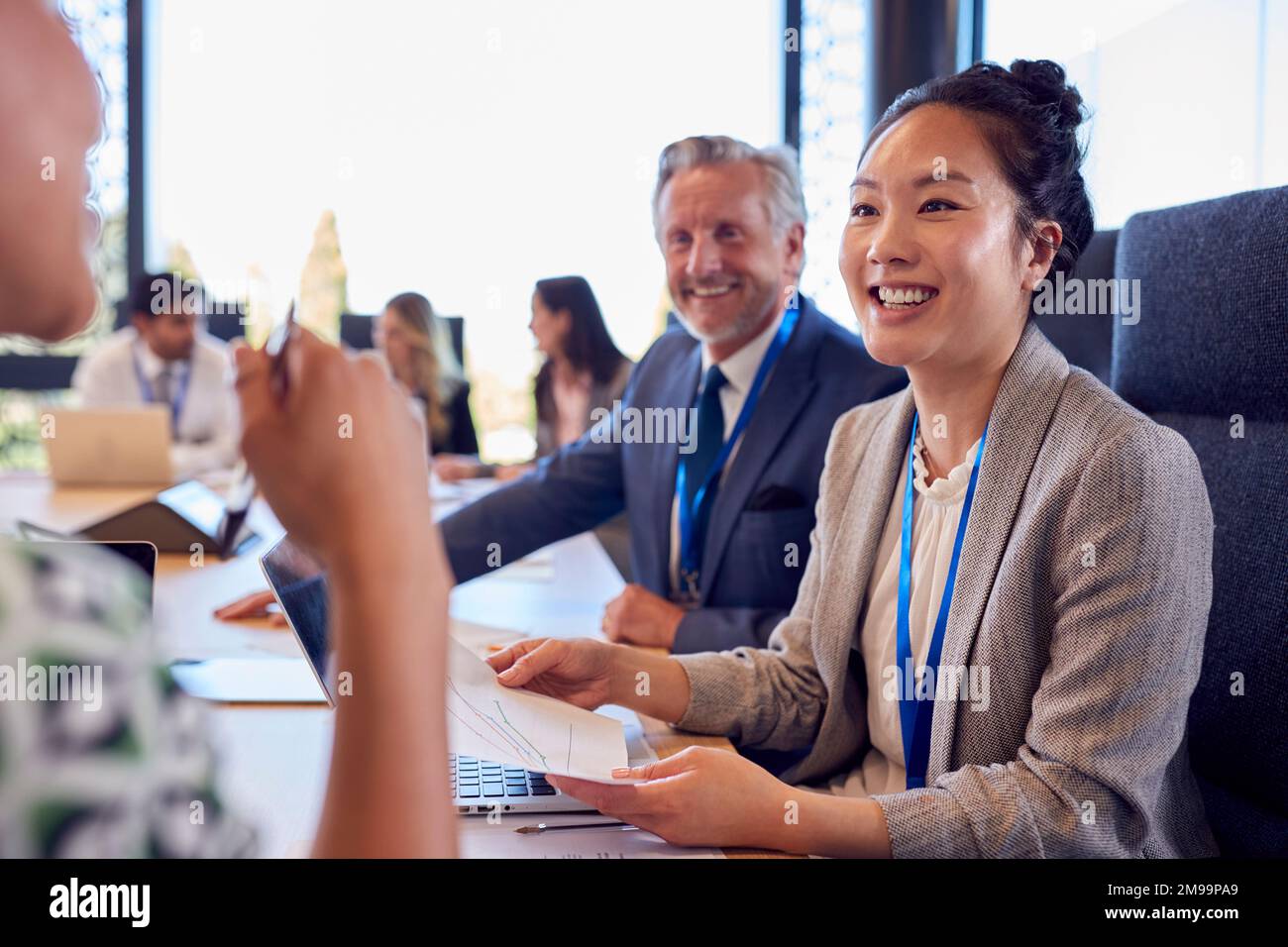 Multi-Cultural Business Team Meeting And Collaborating Around Table In ...