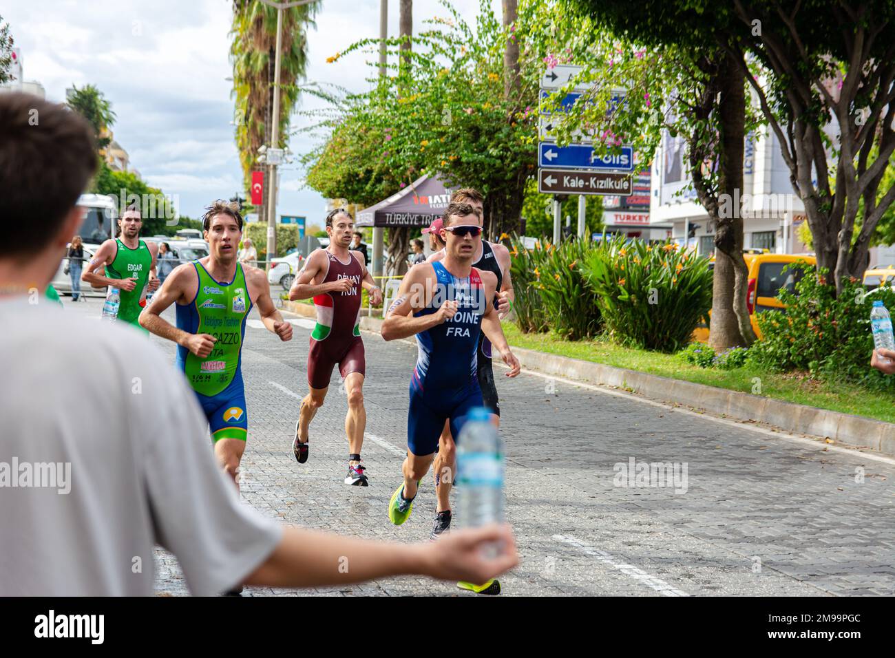 Alanya, Turkey, 16.10.2022: Man athletes from different countries run a ...
