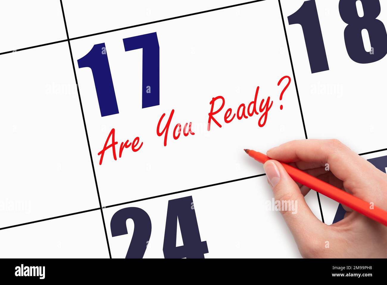 17th day of the month. Hand writing text ARE YOU READY on calendar date ...