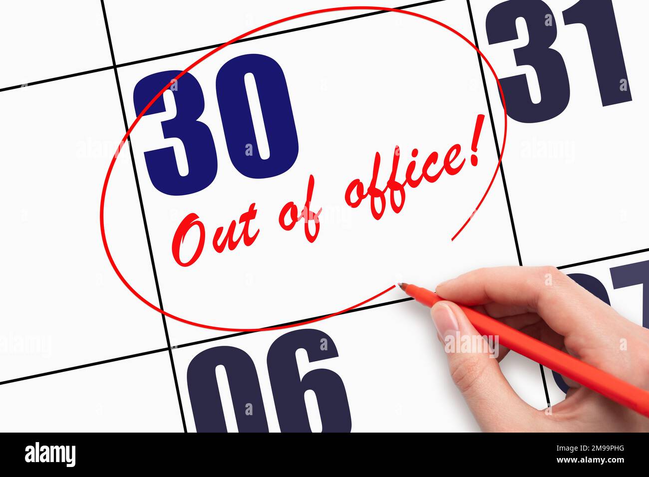 30th day of the month. Hand writing text OUT OF OFFICE and circling the ...